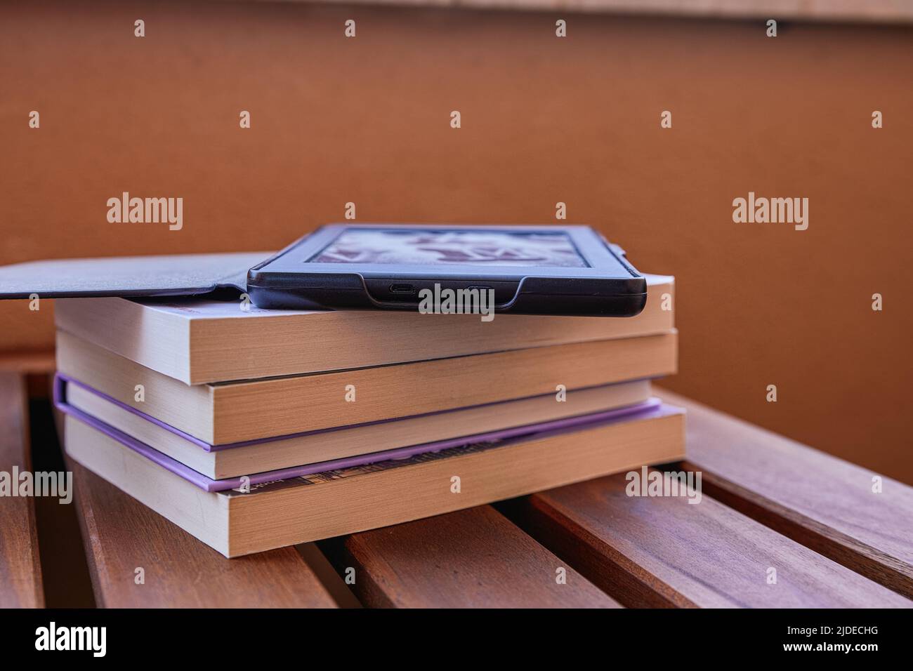 ebook on pile of books, save paper with an electronical book, ecology ...