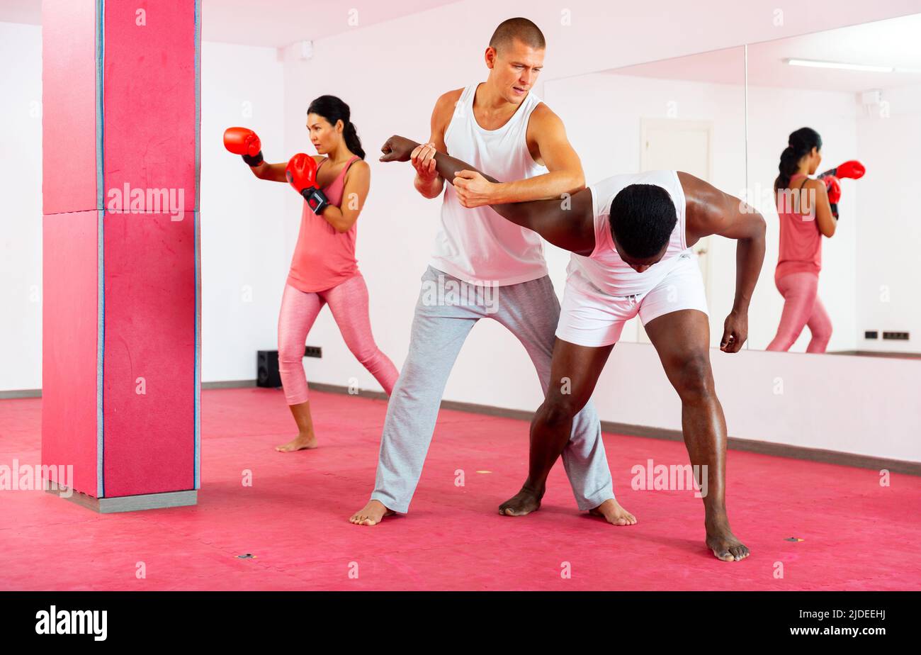 Sparring of two men at self-defense training in sports club Stock Photo ...