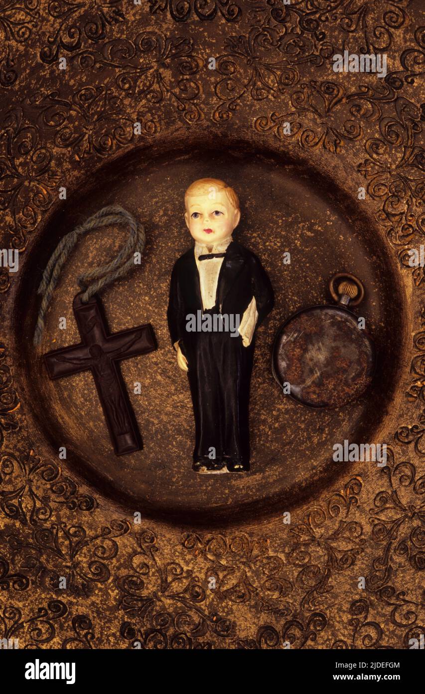 Small model of 1940s butler or waiter lying with small Bakelite ...