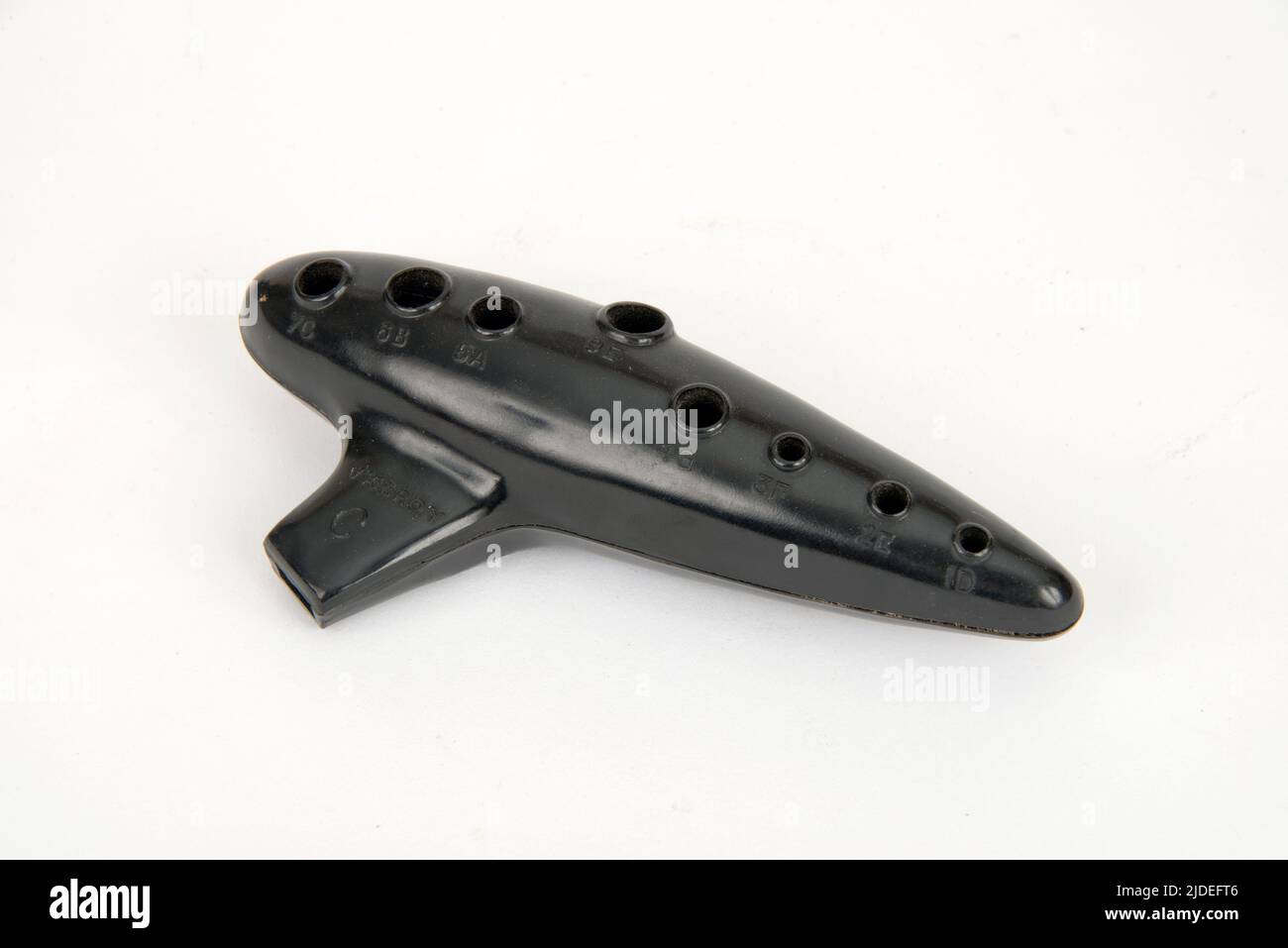 A selection of bakelite and plastic items. Streamlined ocarina (wind ...