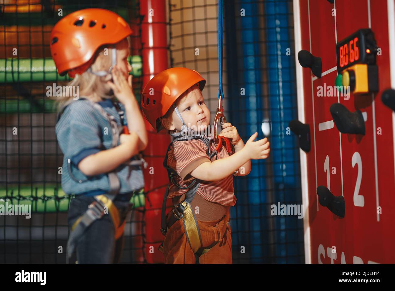 Happy School Boys in Red Helmets on Climbing Class at Indoor Climbing ...