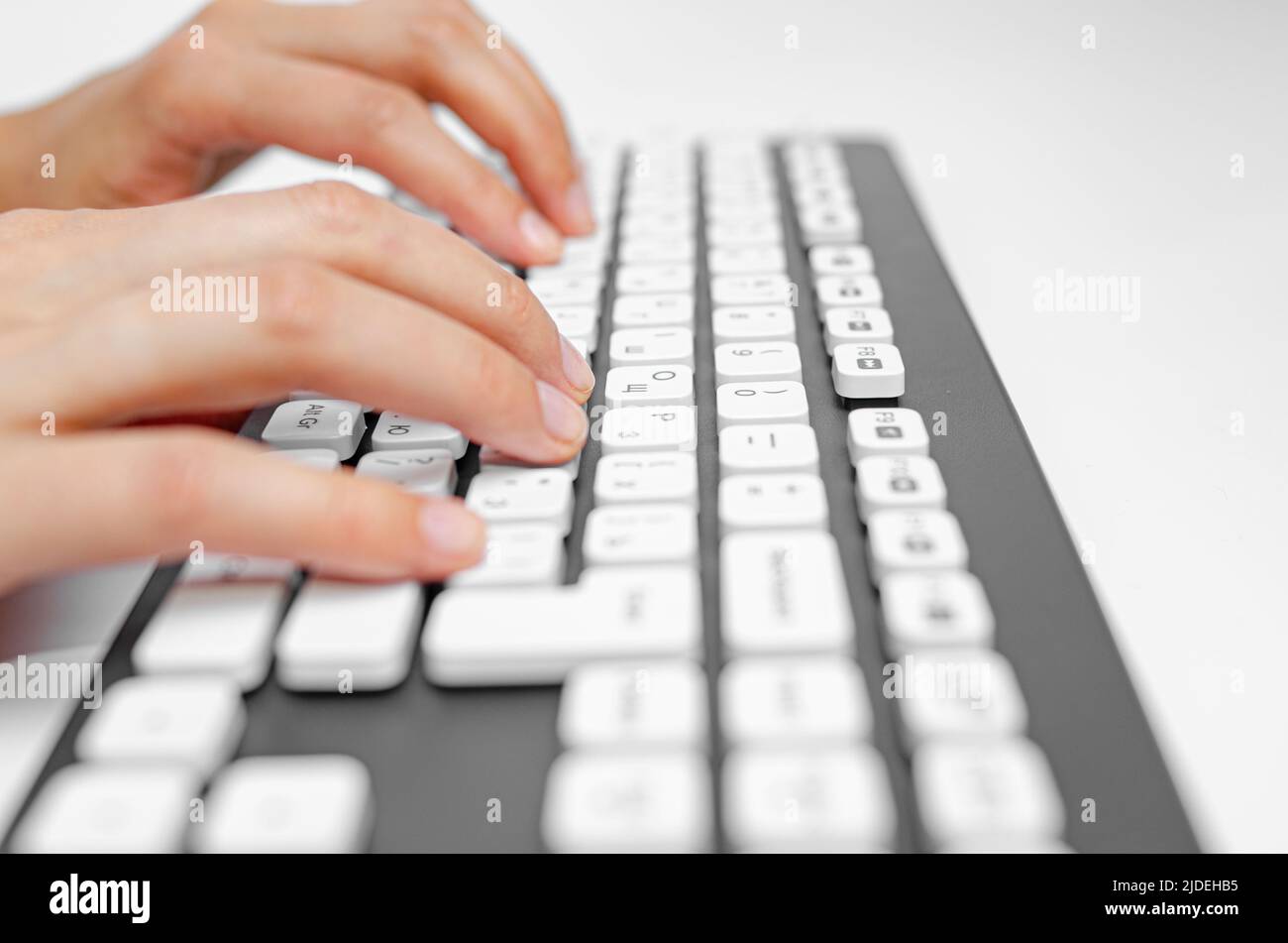 Female office worker typing on the keyboard Stock Photo - Alamy