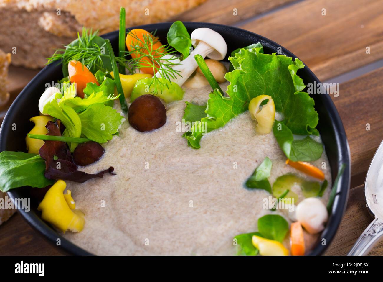 Cream soup with mushrooms and vegetables Stock Photo - Alamy
