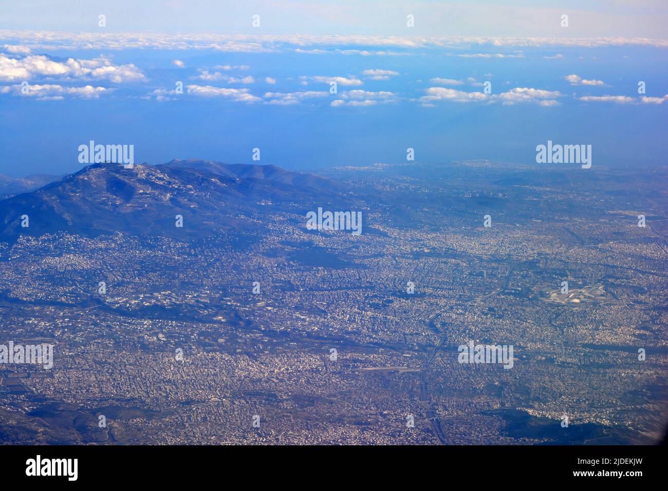 Aerial view of parts of Athens and surrounding mountains, during ...