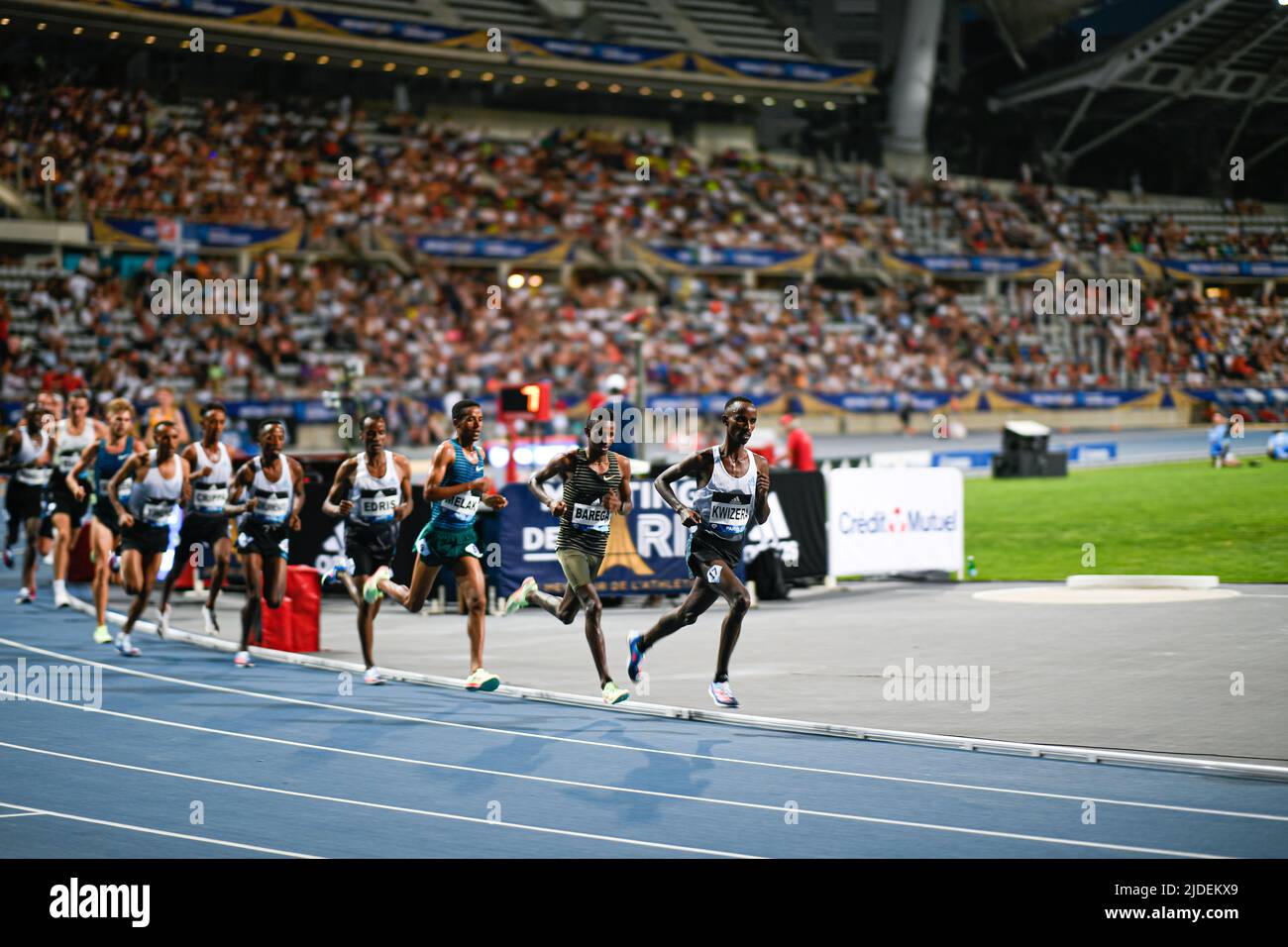 Rodrigue Kwizera and the peloton run (men's 5000m race) during the ...
