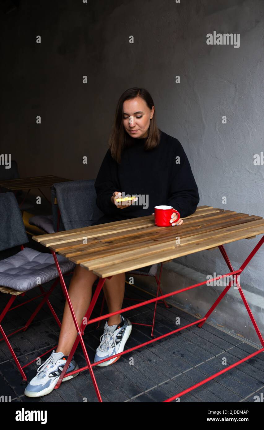 Person alone at cafe hi-res stock photography and images - Alamy