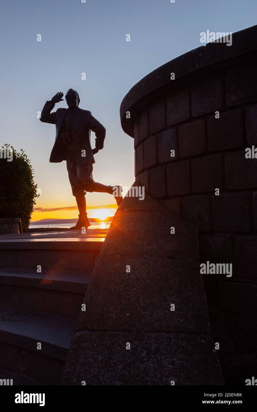 Silhouette of a bronze sculpture of celebrity comedian Eric Morecambe ...
