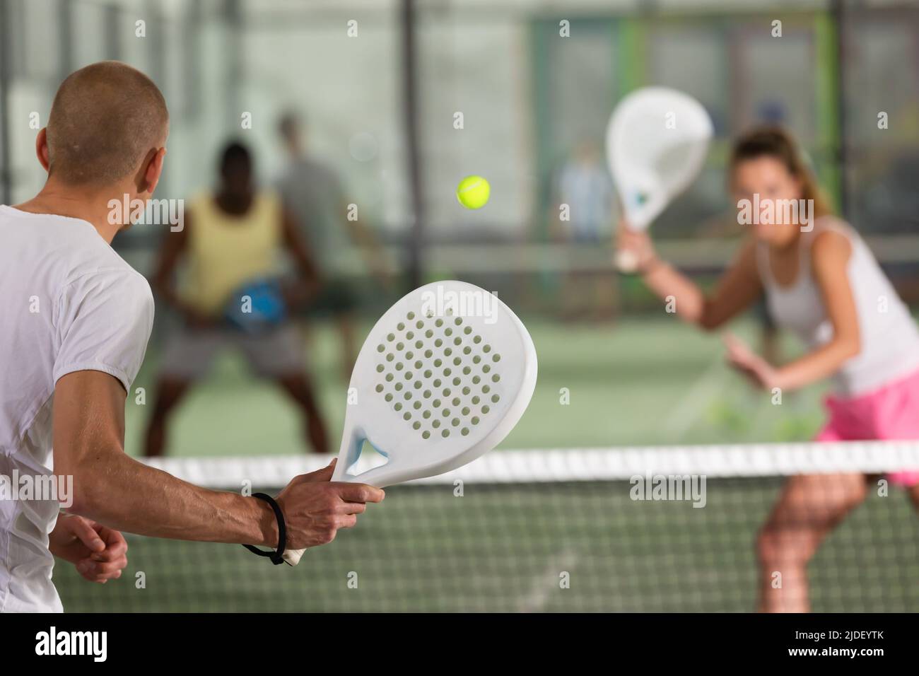 Man playing padel tennis on padel court Stock Photo - Alamy