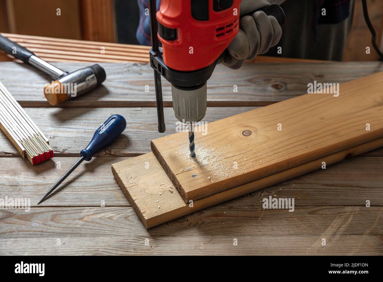 Drill electric tool, hand drilling wood. Construction industry ...