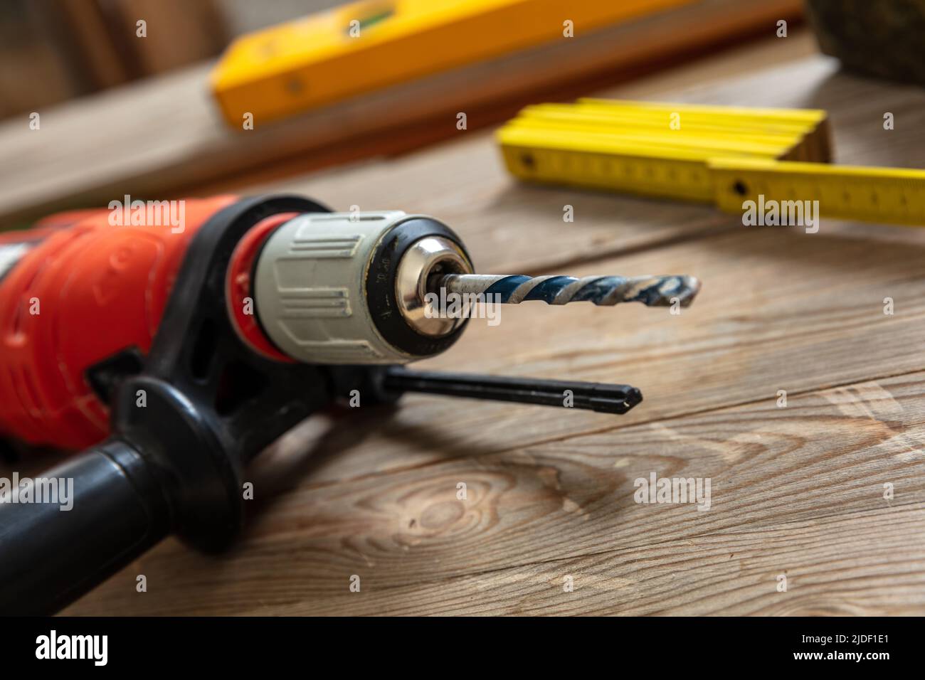 Electric drill tool on carpenter work bench table closeup view. Home ...