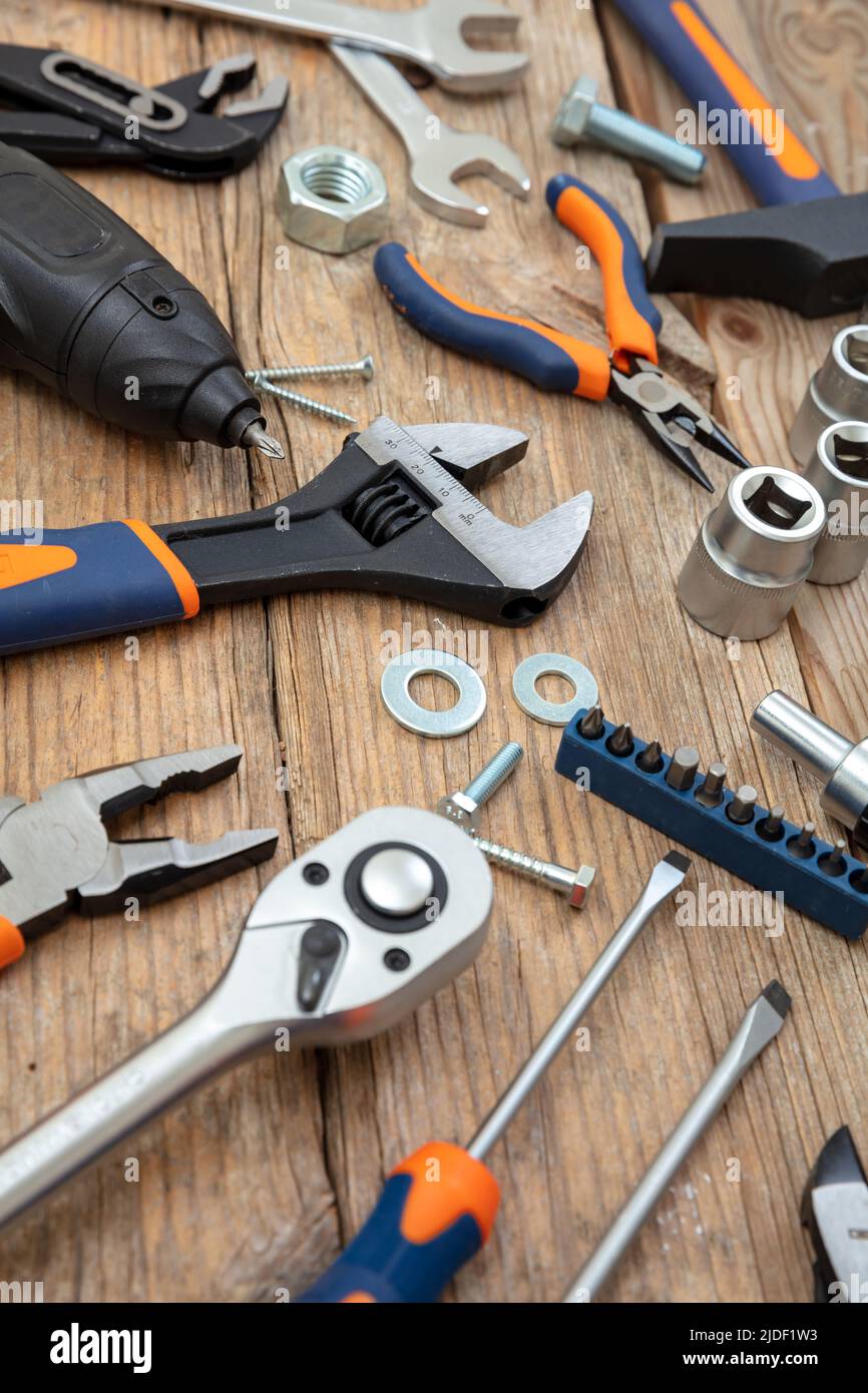 Work tool on wooden background. Hand tool new set with rubber blue and ...