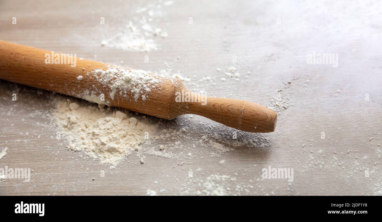 Homemade dough and pastry preparation on kitchen table. Rolling pin ... Homemade dough and pastry preparation on kitchen table. Rolling pin ...