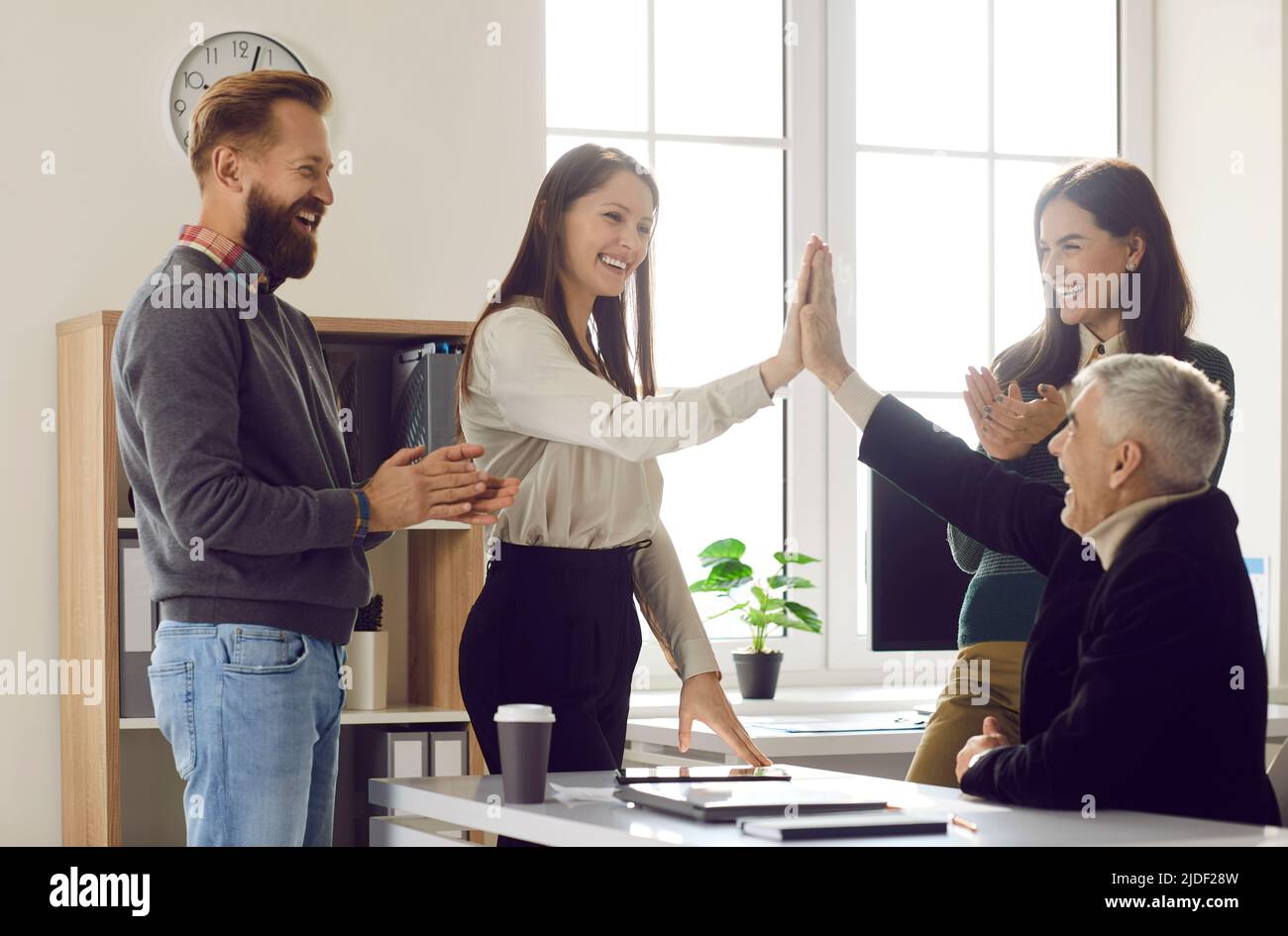 Coworker high five hi-res stock photography and images - Alamy