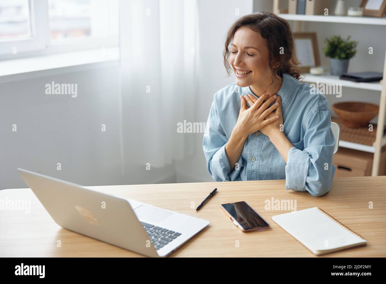 Happy enthusiastic joyful contented cute female office worker ...