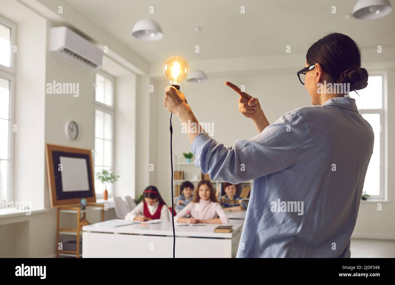 Creative school teacher tells students about electricity and shows them ...