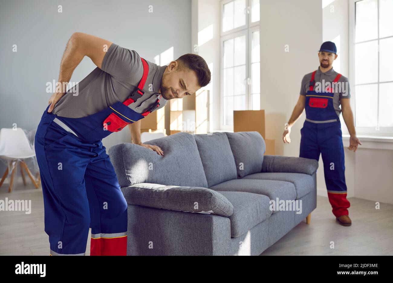 Delivery service worker feels pain in his lower back when he tries to ...