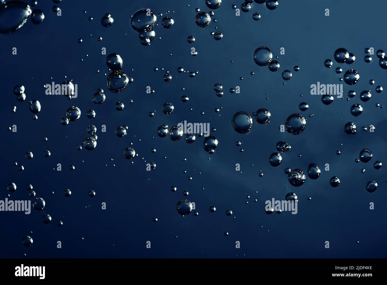 Close up macro Aloe vera gel serum cosmetic texture blue background ...