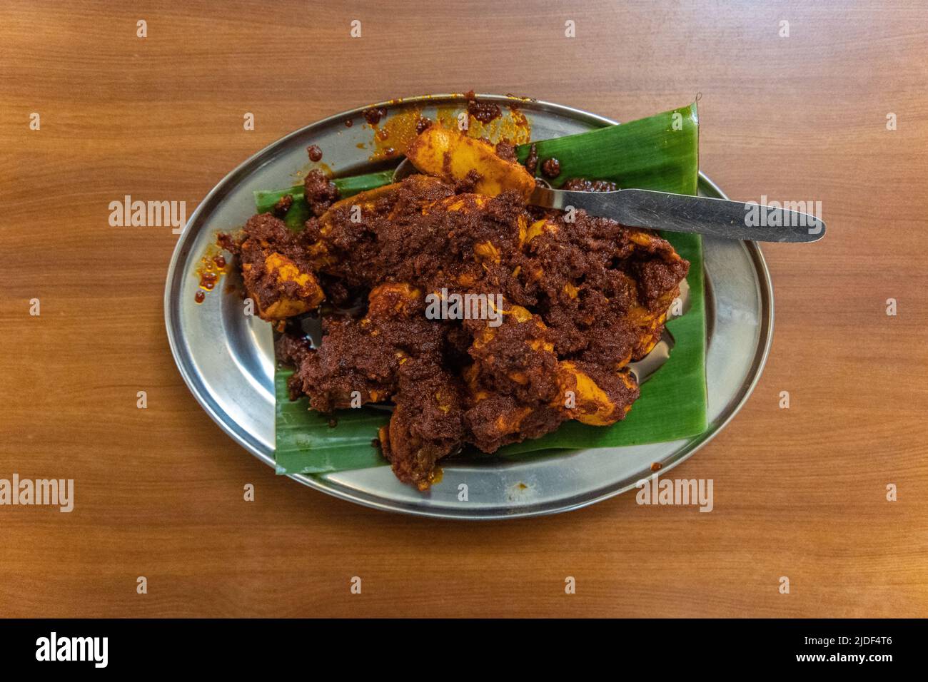 Top view of Chicken Ghee Roast served on Banana Leaf Stock Photo - Alamy