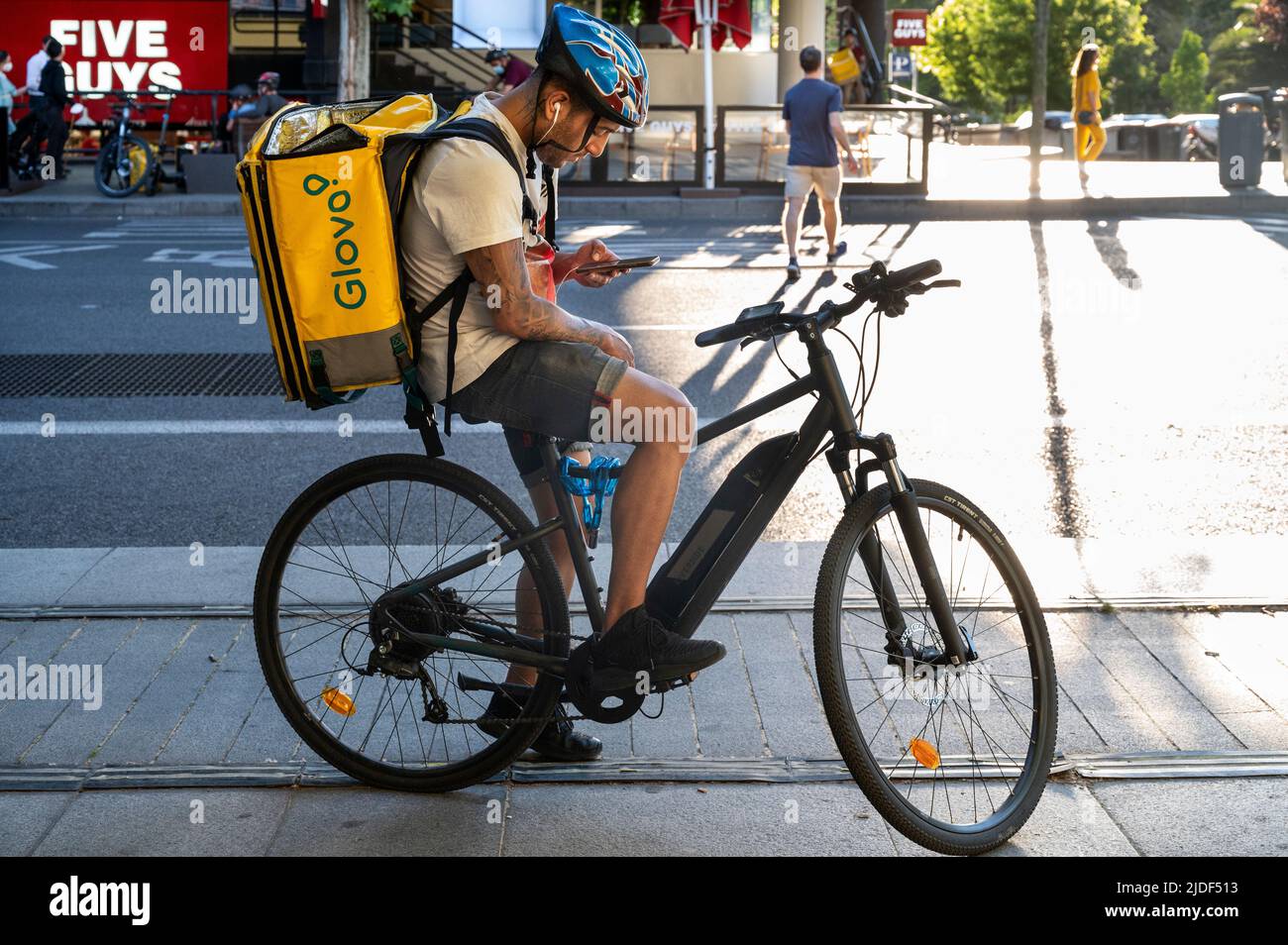 A worker from the Spanish start-up on-demand delivery company, Glovo ...