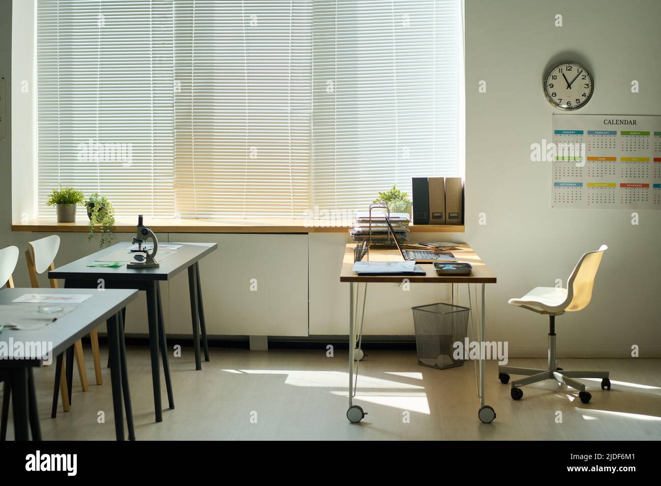 Empty classroom during break with laptop and other supplies on ...