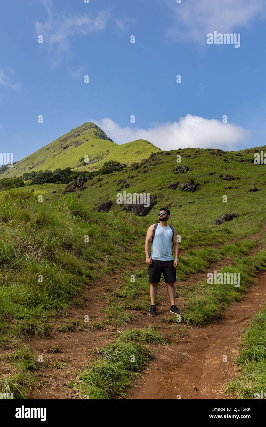 A trekker on the trail to Chembra Peak in Wayanad, Kerala Stock Photo ...