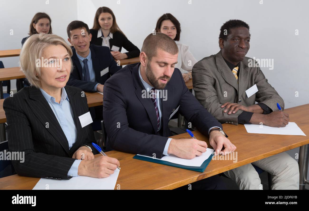 People during business seminar in lecture hall Stock Photo - Alamy