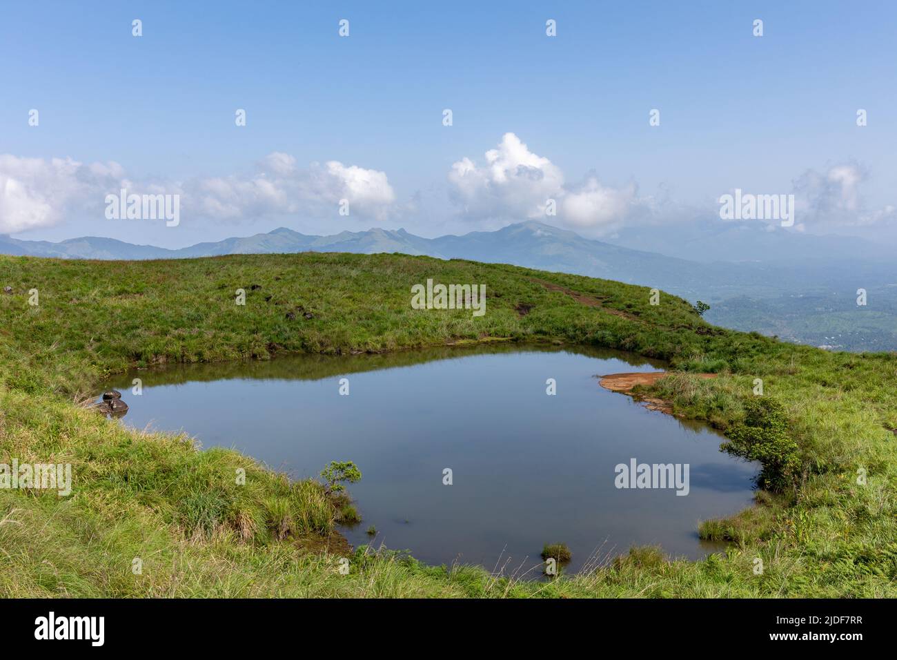 The heart shaped lake on top of Chembra Peak in Wayanad, Kerala Stock ...