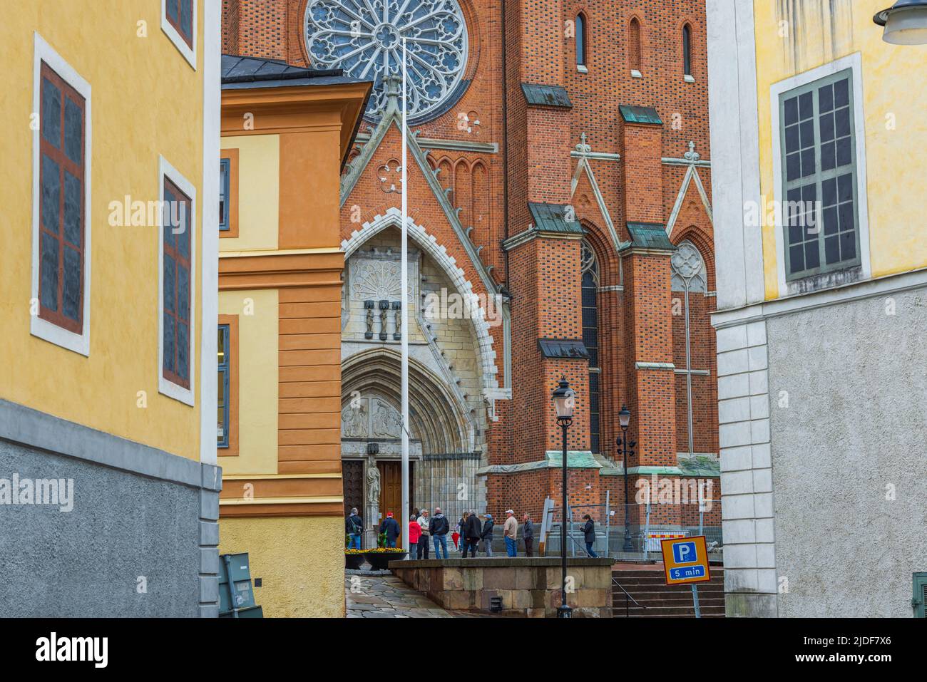 Beautiful view of cathedral church with people standing near entrance ...