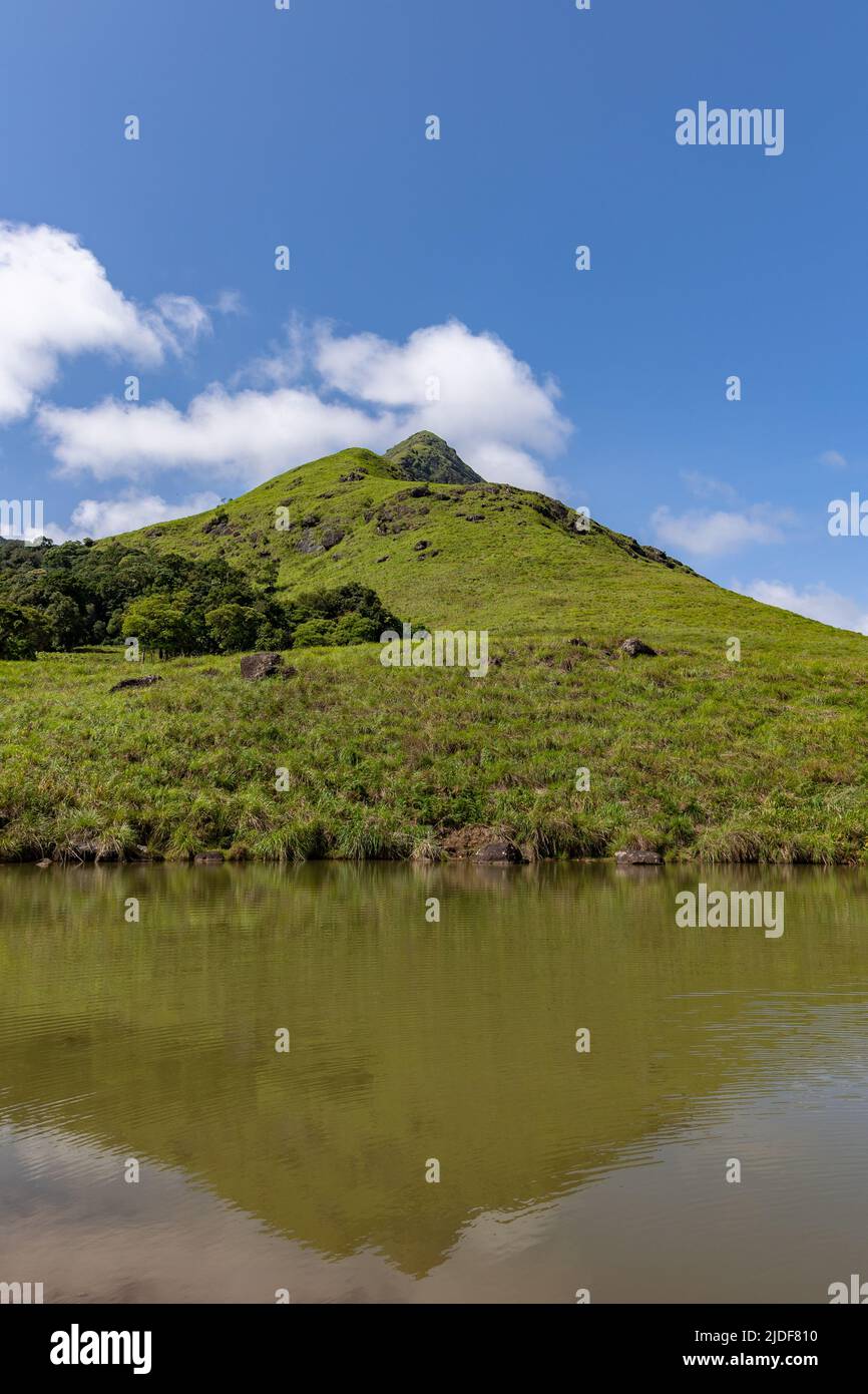 View of the Chembra Peak, with its reflection in the heart shaped lake ...