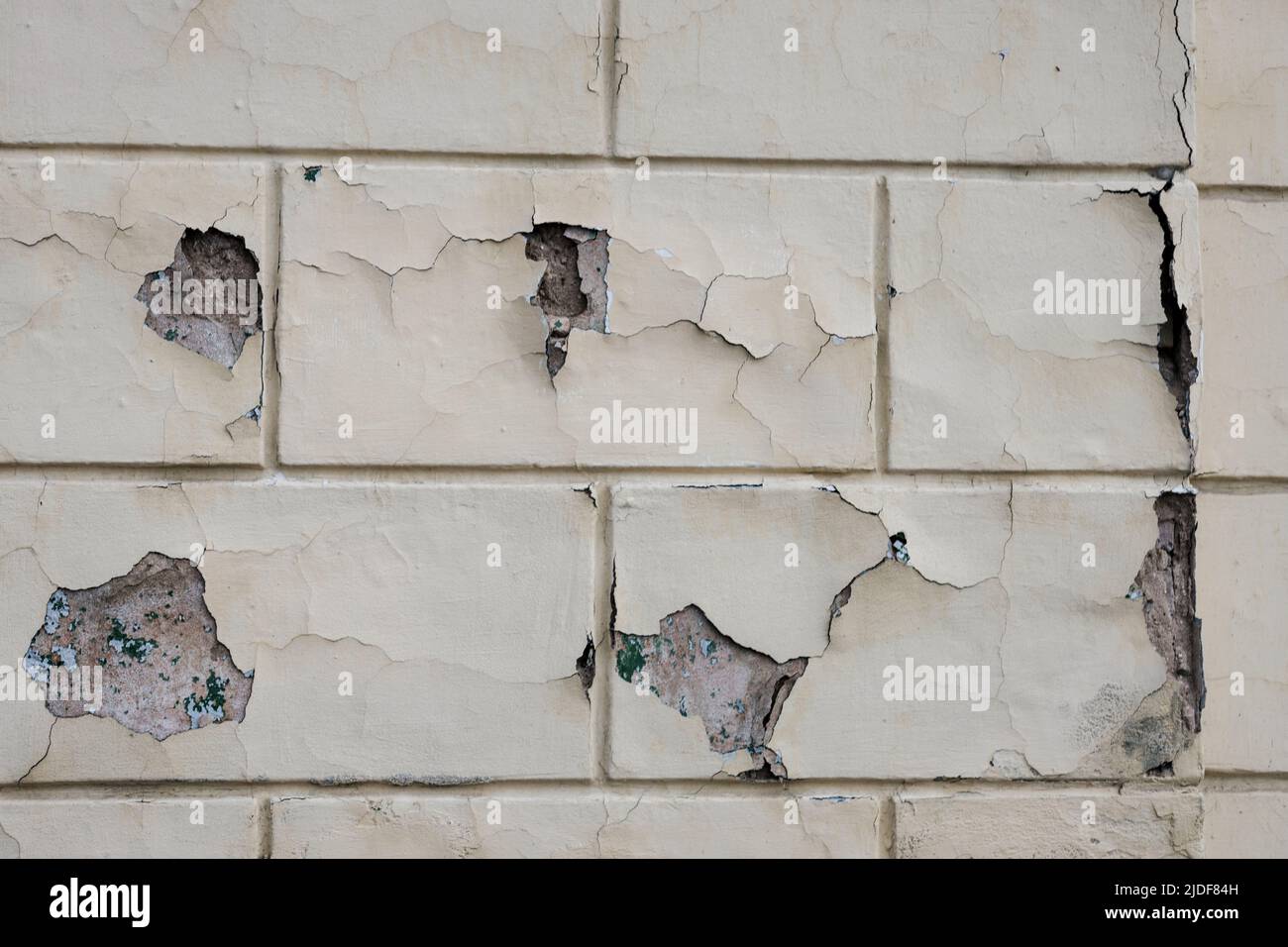 Stonewall Surface. Peeling paint on wall with concrete surface Stock ...