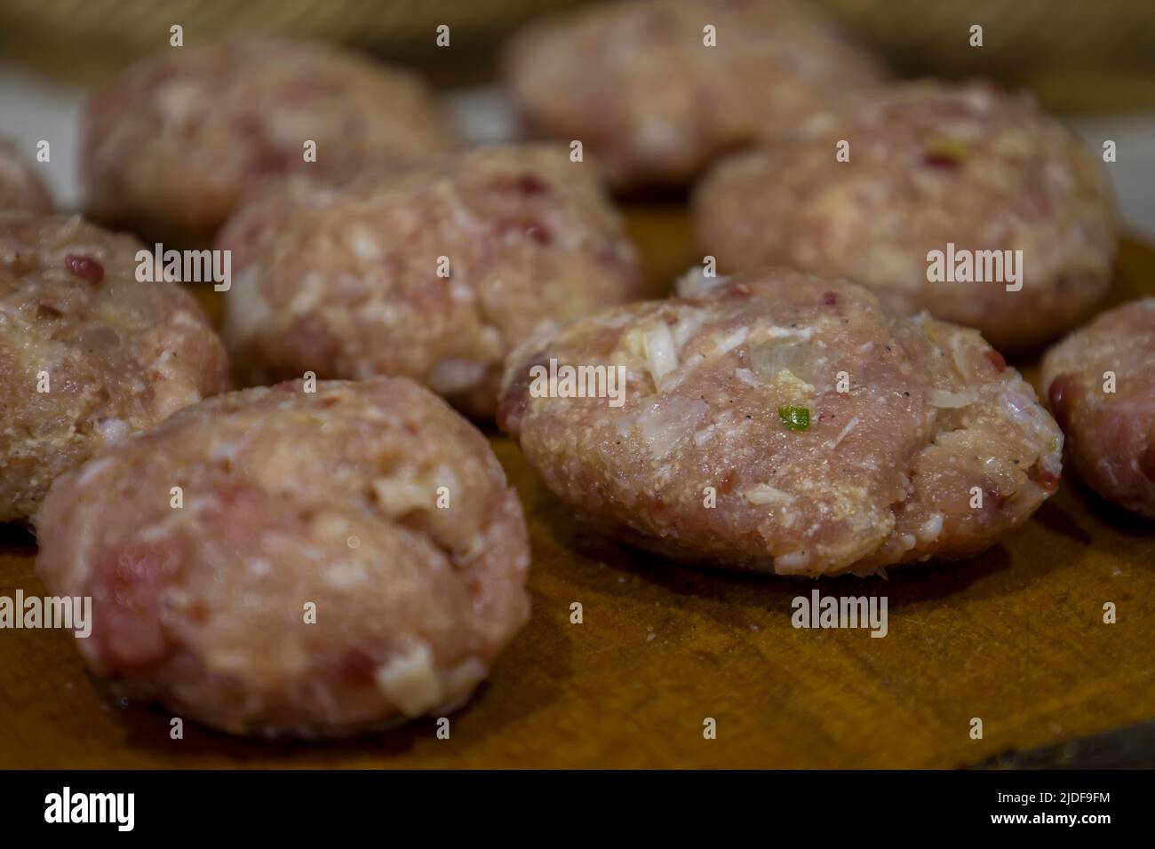 Raw meatballs on the board Stock Photo - Alamy