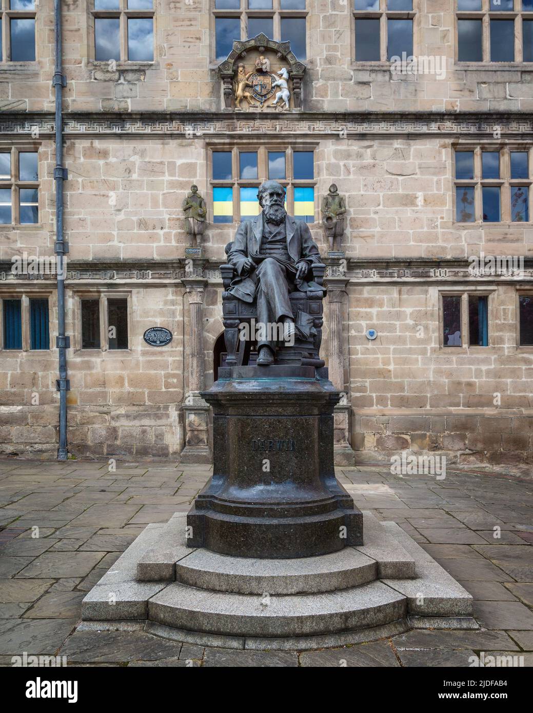 A bronze statue of Charles Darwin outside Shrewsbury library. The ...