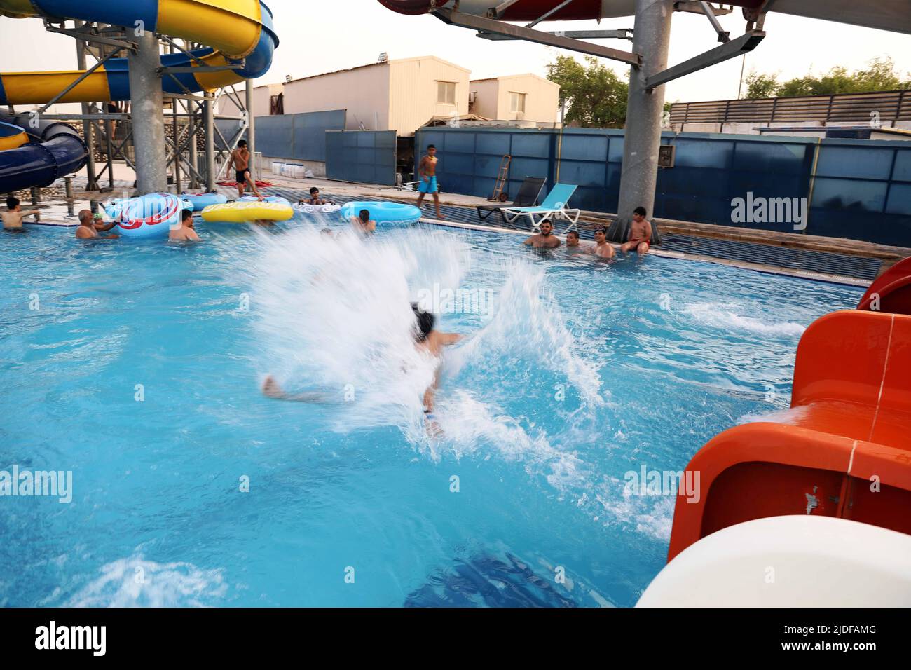 Baghdad, Iraq. 20th June, 2022. People spend time at a water park ...