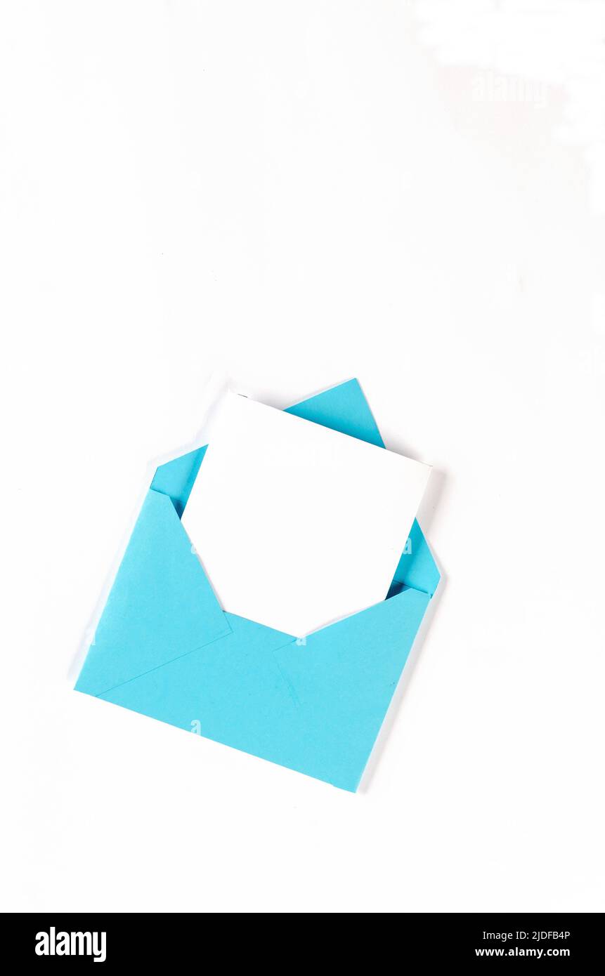open blue envelope with white paper sheet on white background with ...