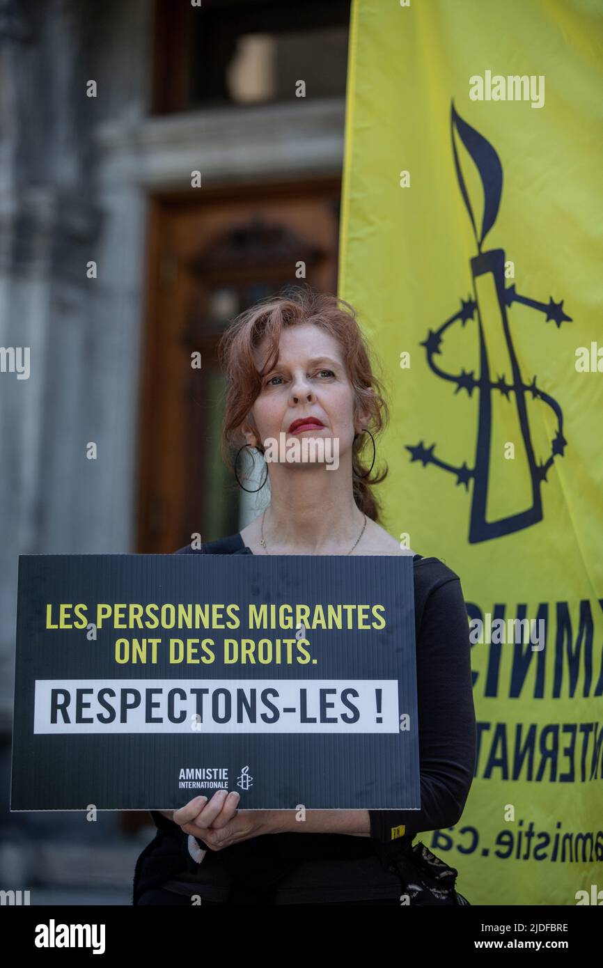 An Amnesty International demonstrator in front of the organization's ...