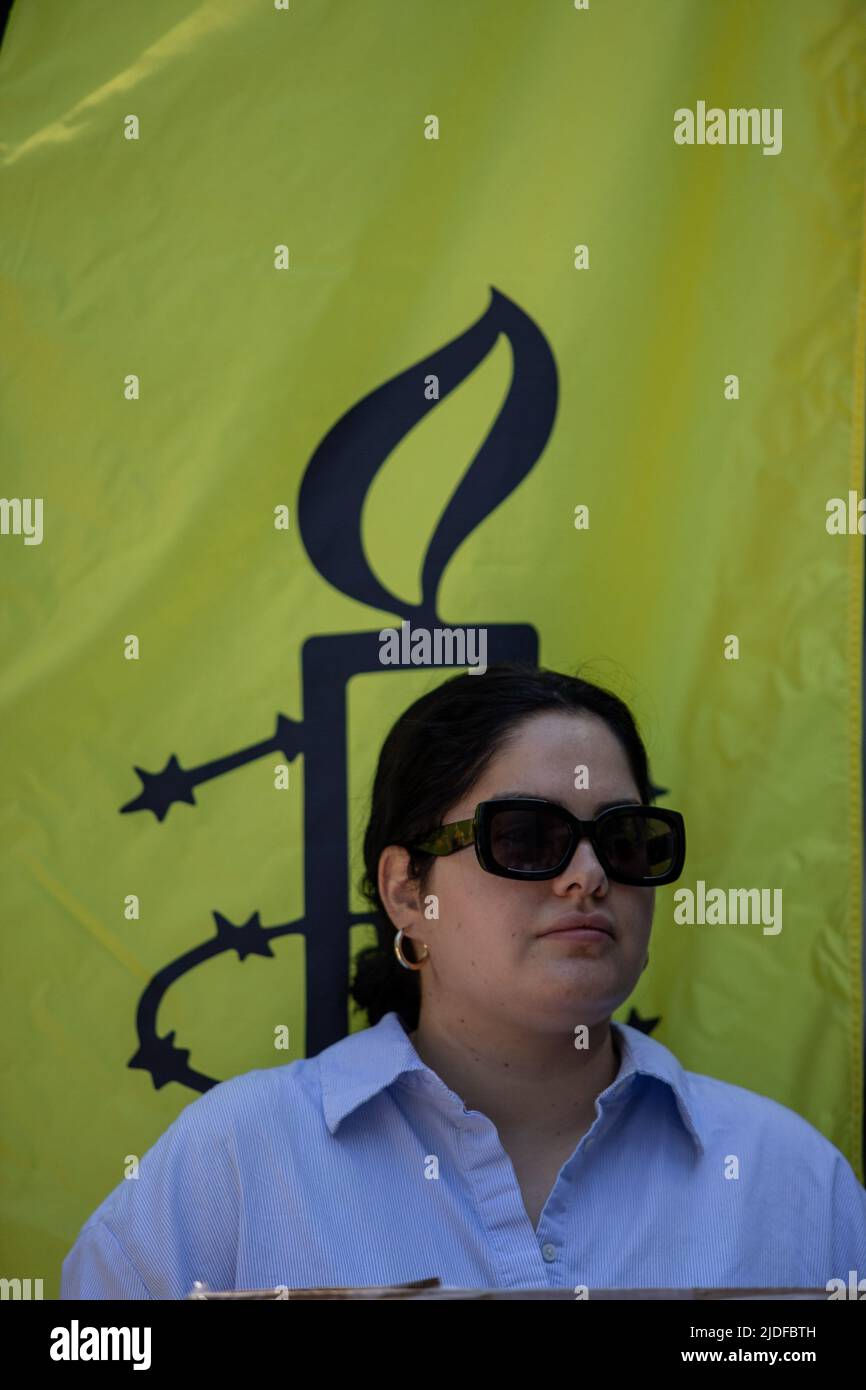 An Amnesty International demonstrator in front of the organization's ...
