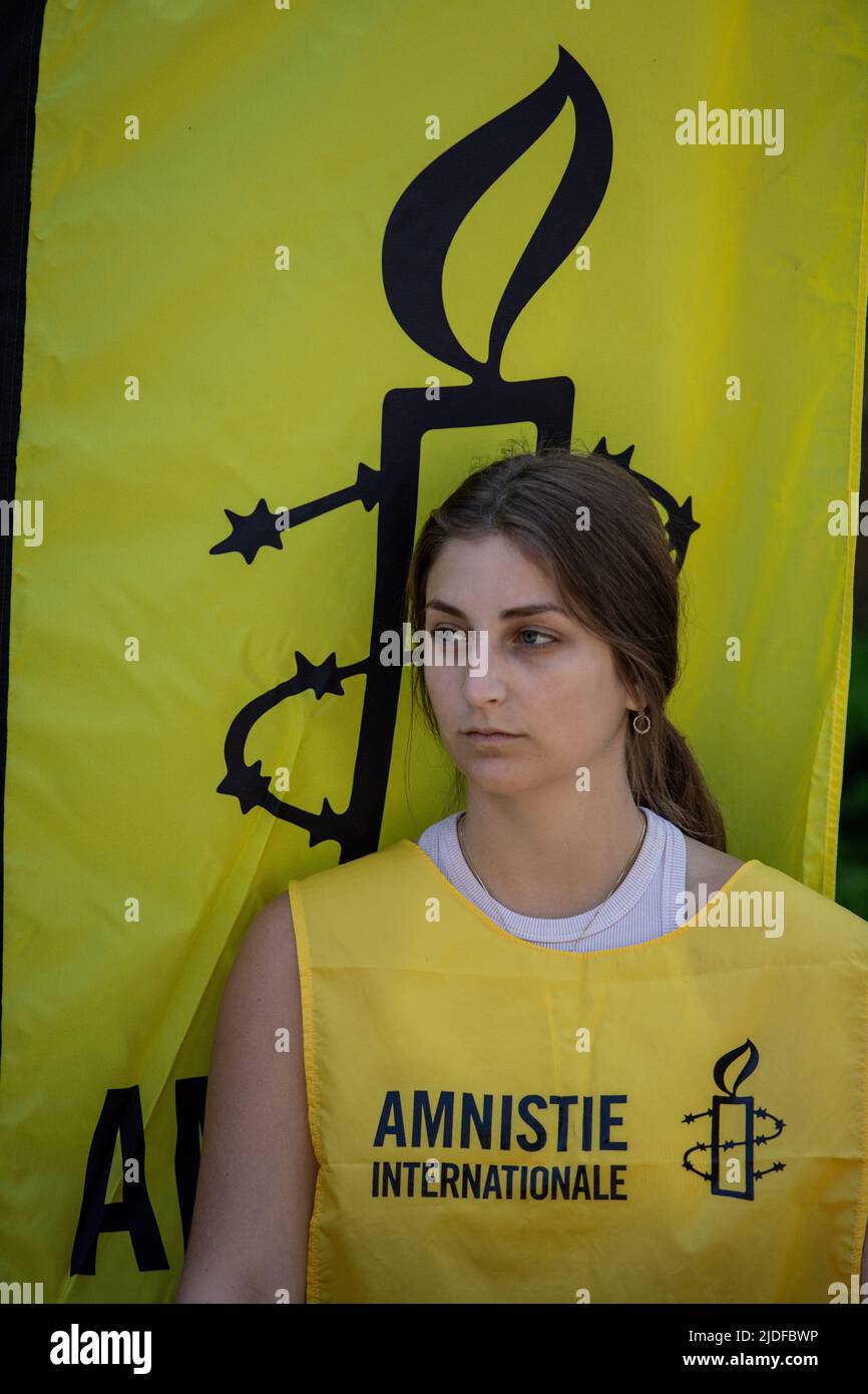 An Amnesty International demonstrator in front of the organization's ...