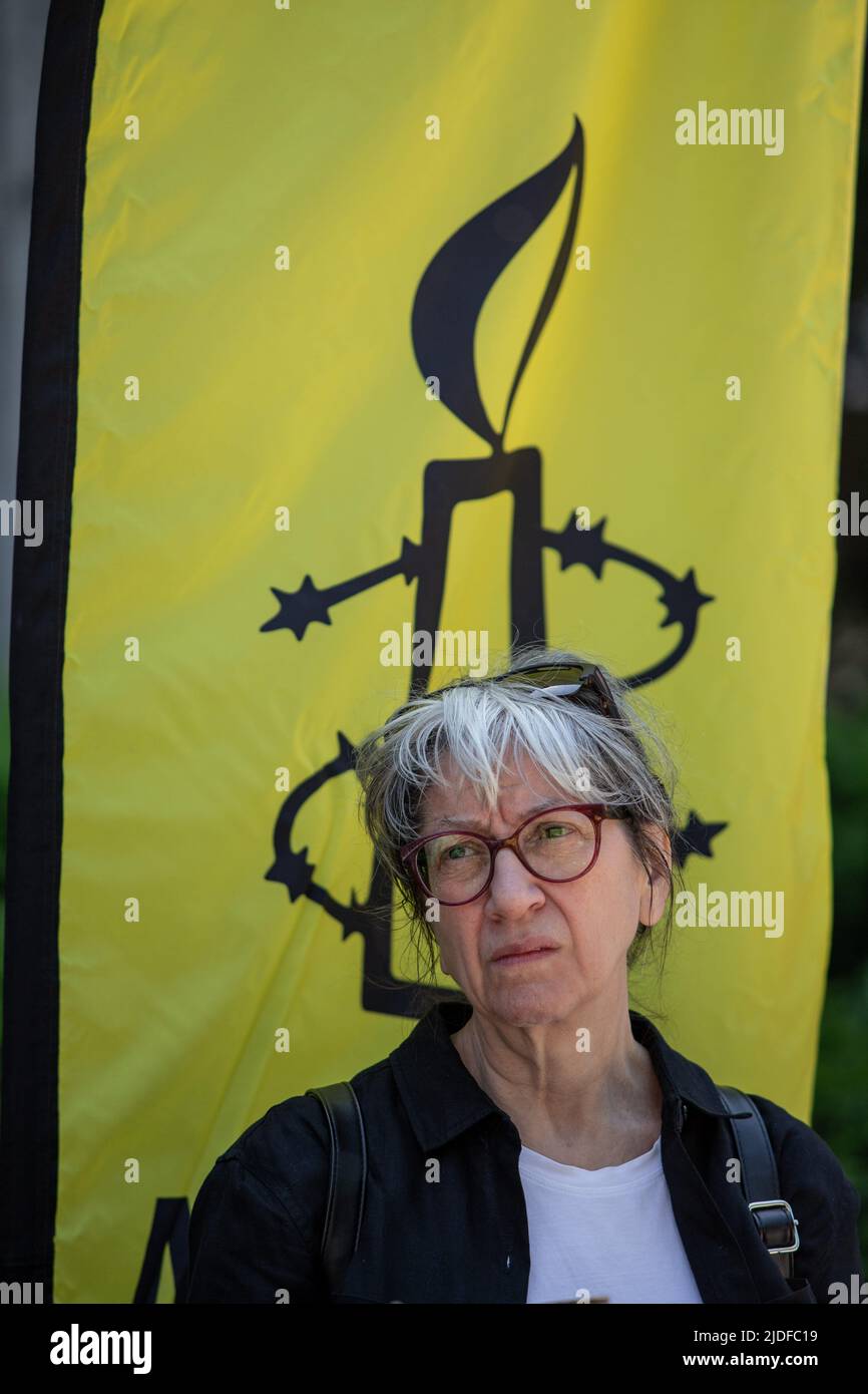 An Amnesty International demonstrator in front of the organization's ...