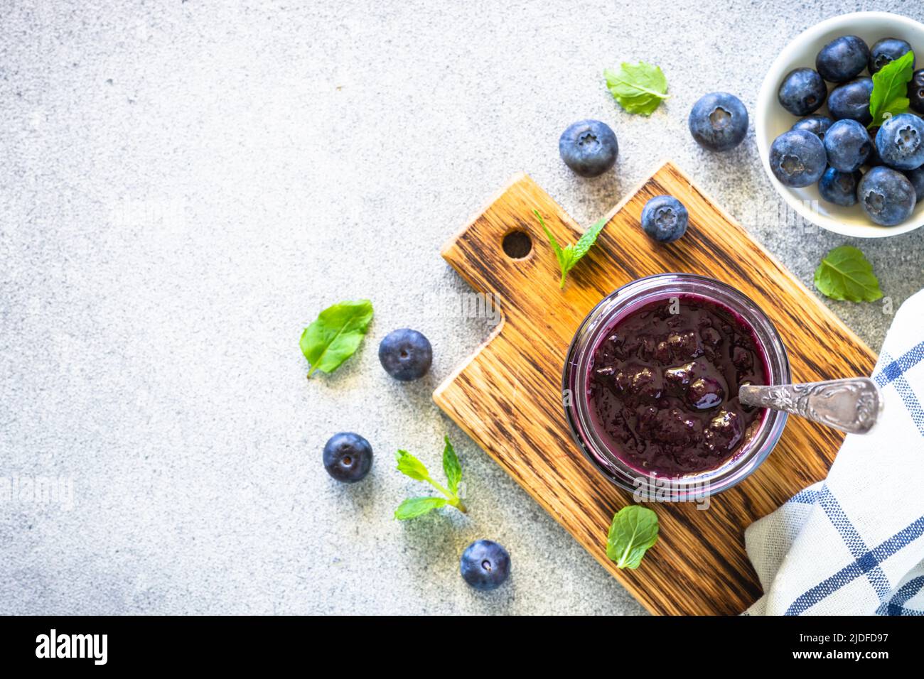 Blueberry jam in the glass jar with fresh berries Stock Photo - Alamy