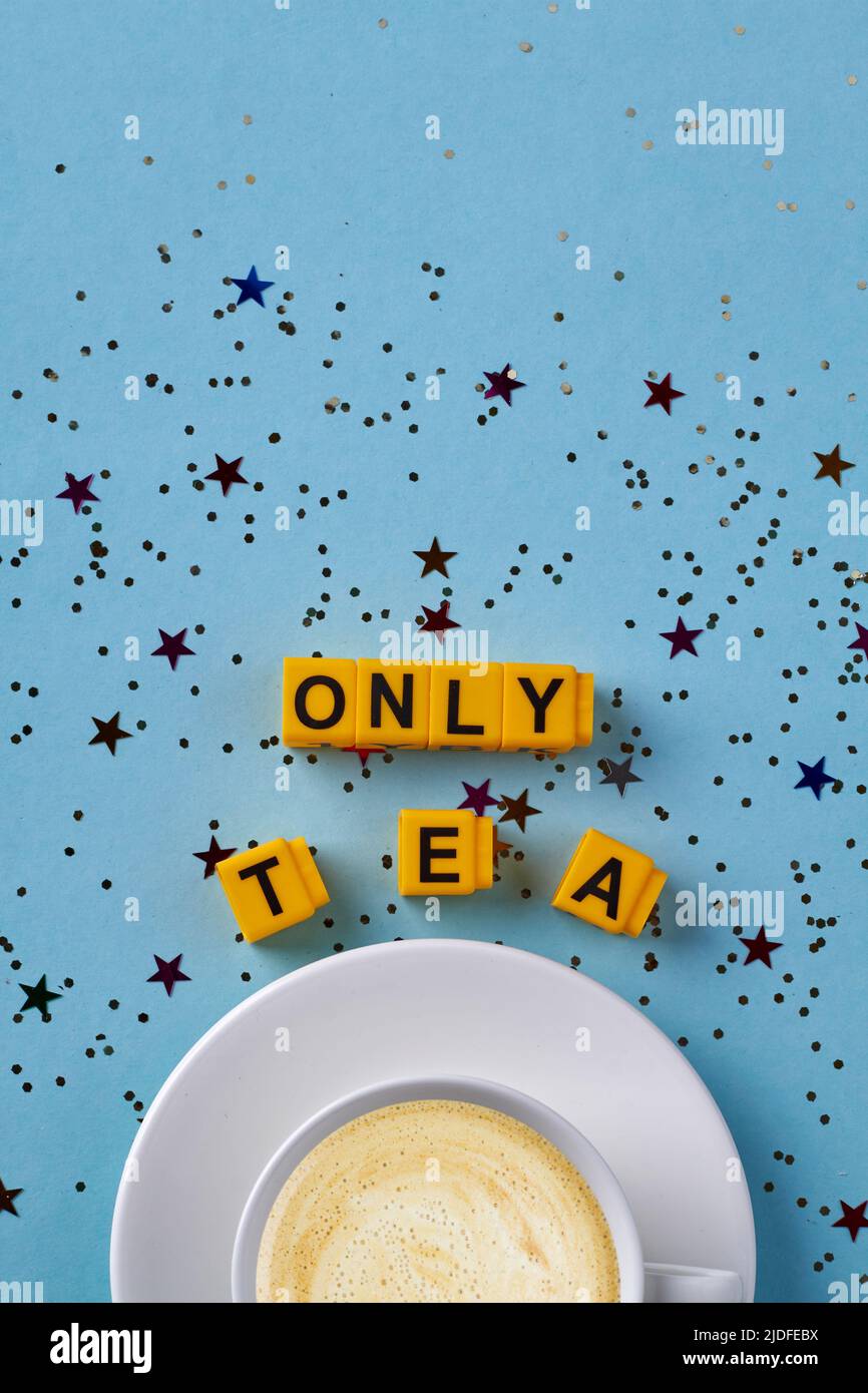 Vertical shot flat lay only tea concept. Cup of cappuccino. Confetti on ...