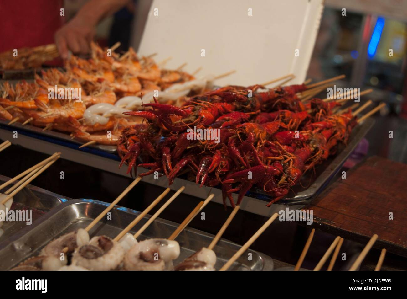 Fresh fish skewers in a street market. Beijing, China Stock Photo - Alamy