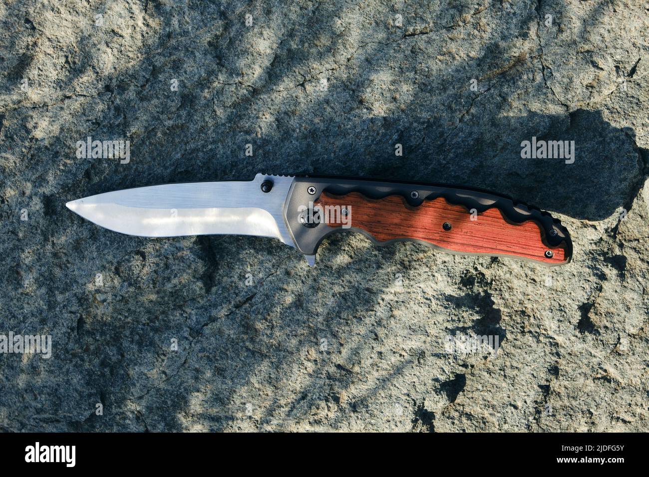 Tactical knife survival and protection difficult conditions, on stone ...