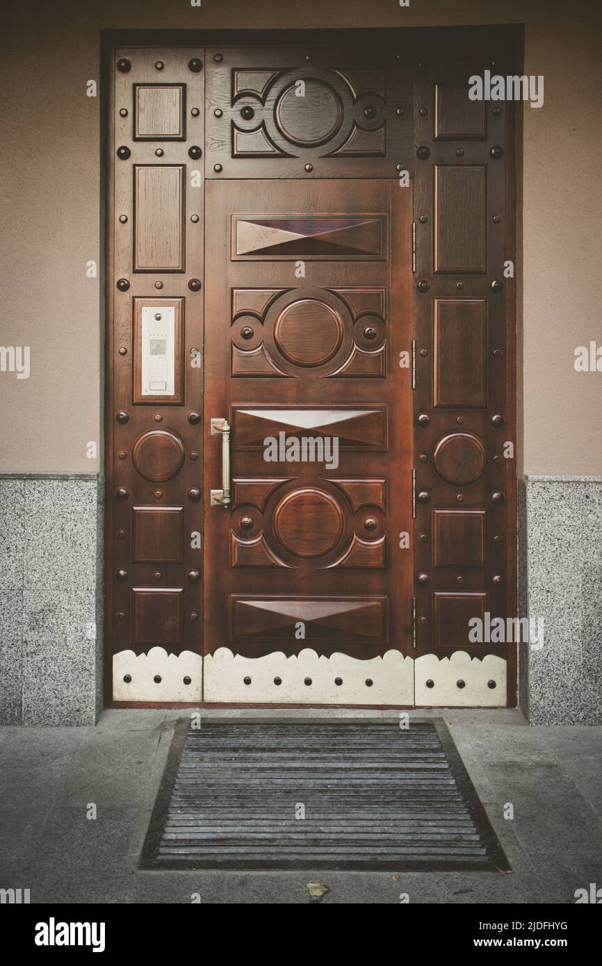 Wooden entrance door.The street front of an town house built Stock ...