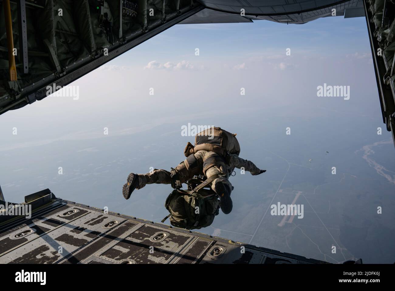 A U.S. Army 1st Special Forces Group team member conducts a military free fall jump over ...