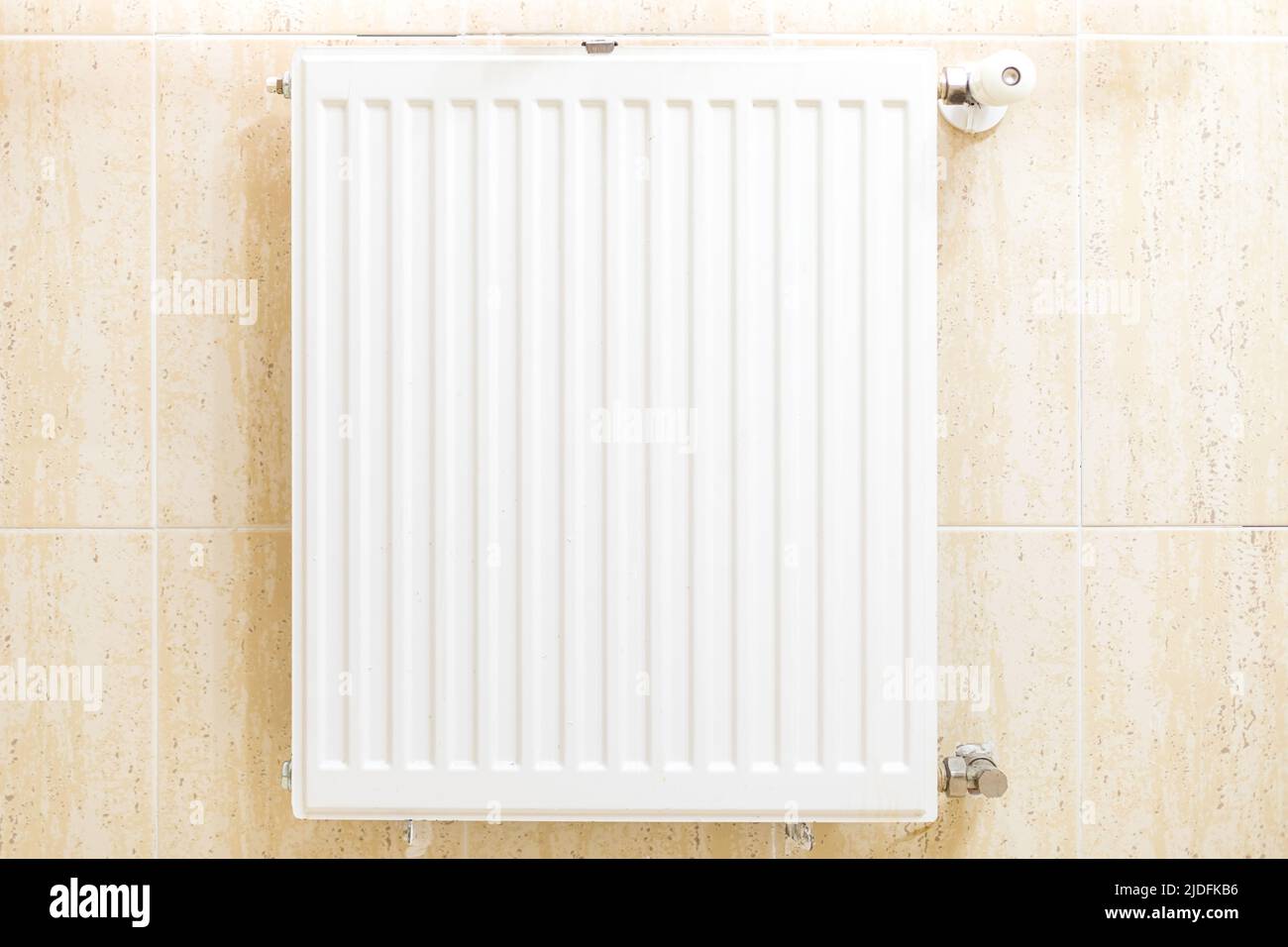 White iron central heating radiator inside a house. Concept of gas ...