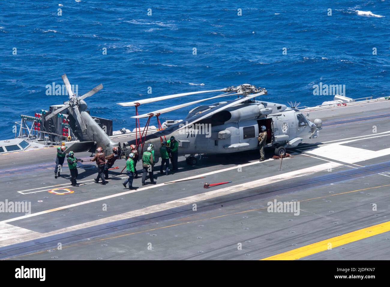 220618-N-KU796-1050 PACIFIC OCEAN (June 18, 2022) Sailors prepare an MH ...