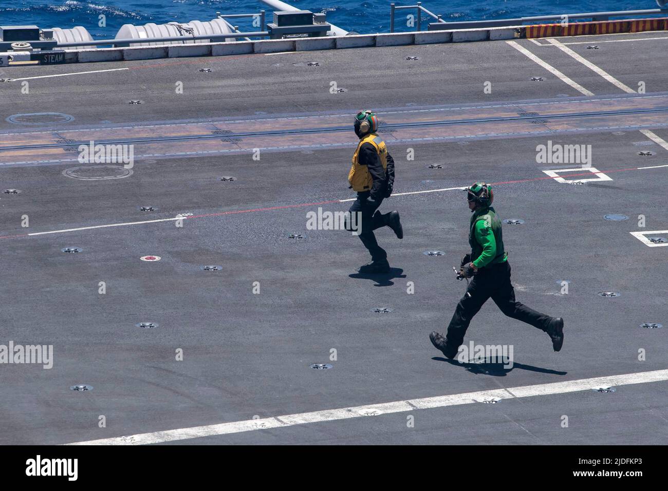 220618-N-KU796-1114 PACIFIC OCEAN (June 18, 2022) Sailors run to secure ...