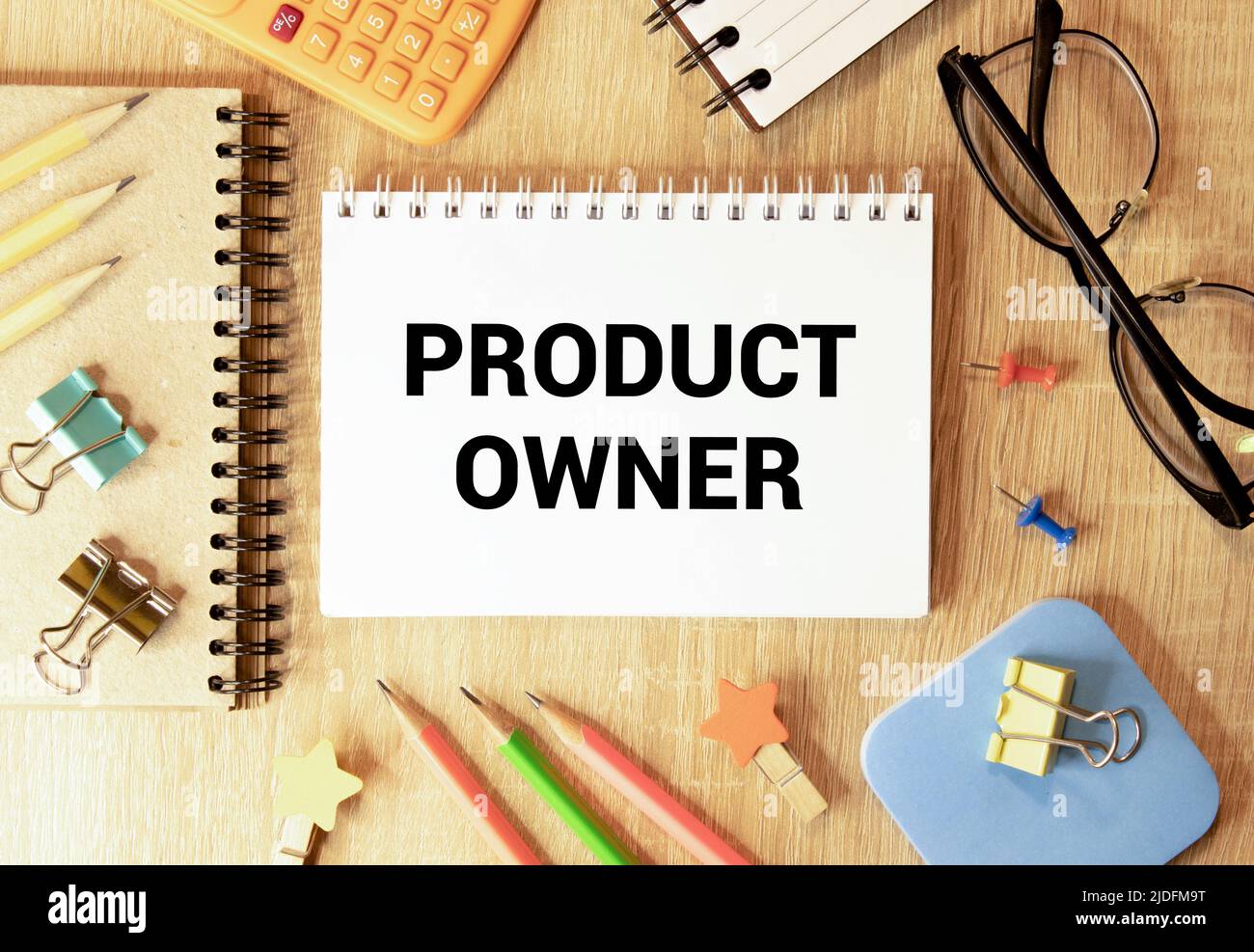 PRODUCT OWNER . Text written on the notepad with office tools and ...