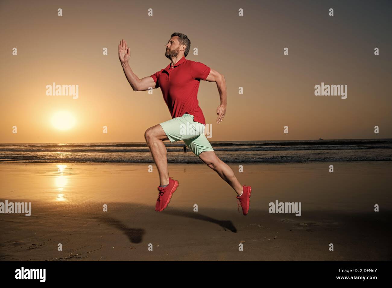 adult sprinter. sport athlete run fast to win in sea sunset. morning ...