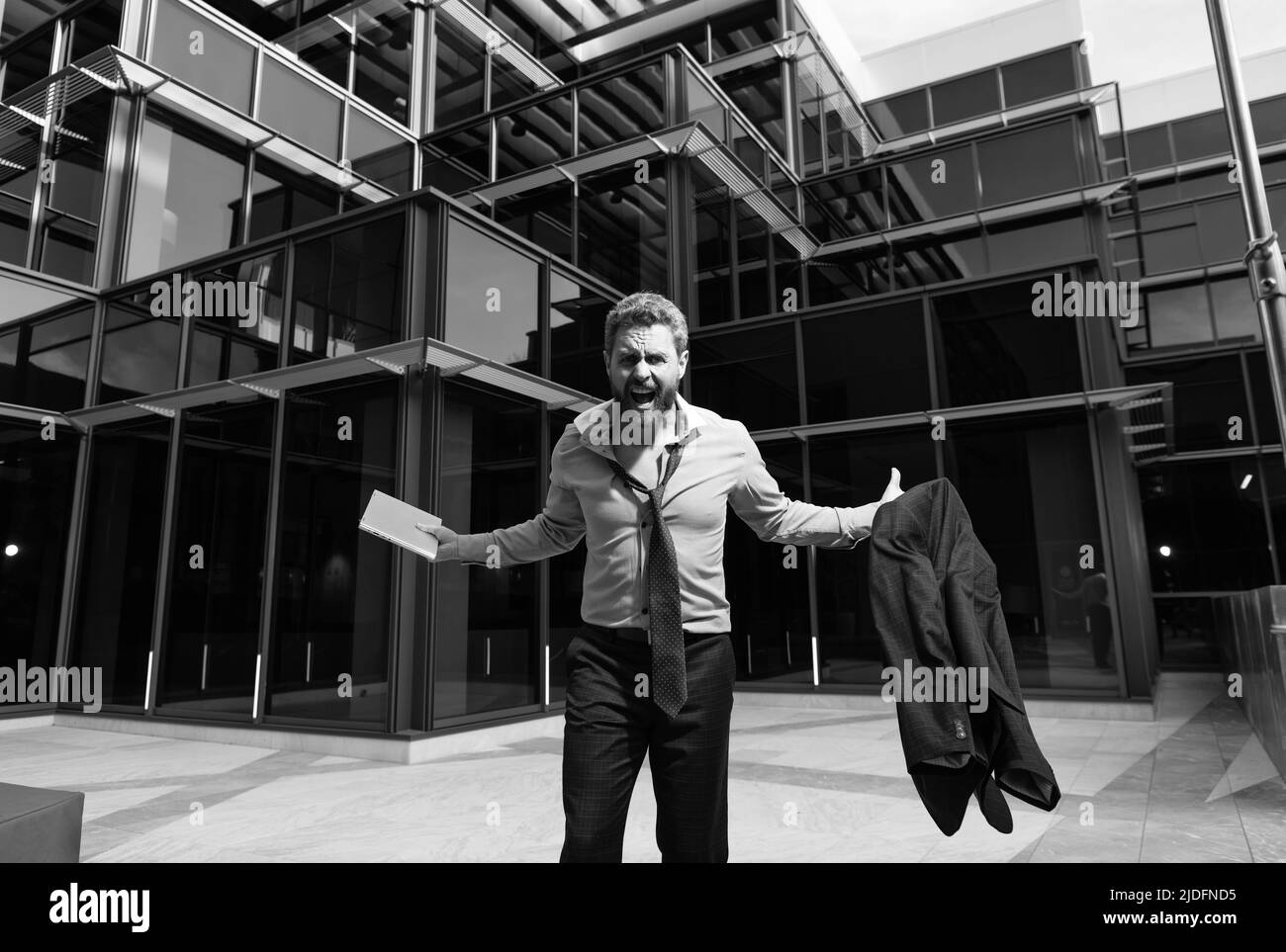 stressed businessman after project failure shouting crying with jacket ...